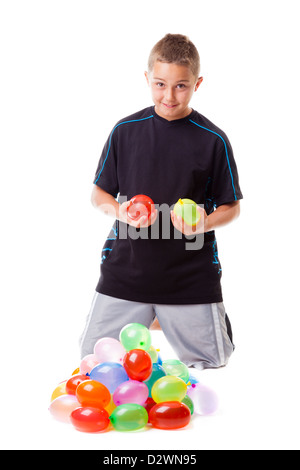 Boy with a pile of water balloons isolated on white background Stock ...