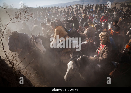 Buzkashi players often lock in clusters in a struggle to pick up the ...
