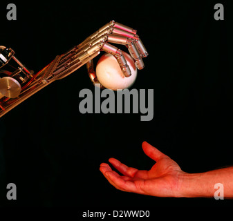 Berlin, Germany, Bionic hand and human hand Stock Photo - Alamy