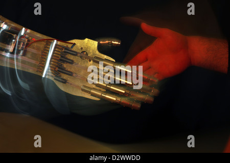 Berlin, Germany, Bionic hand and human hand Stock Photo - Alamy