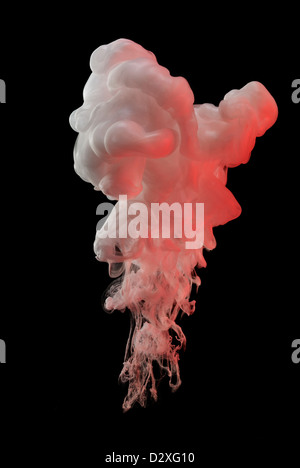 Pink and red cloud of smoke of black isolated background. Background ...