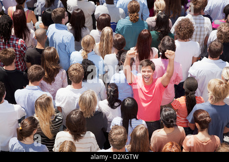 Enthusiastic crowd cheering Stock Photo - Alamy