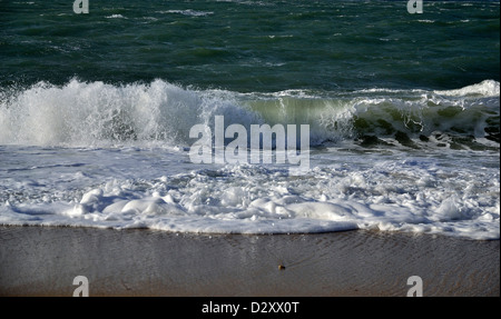 Backwash, in flood tide, breaking waves, swash and backwash over ...