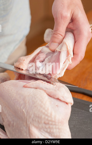 Chef cutting a raw chicken Stock Photo - Alamy