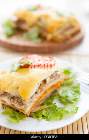 Composition with tasty vegetable lasagna on color wooden background ...