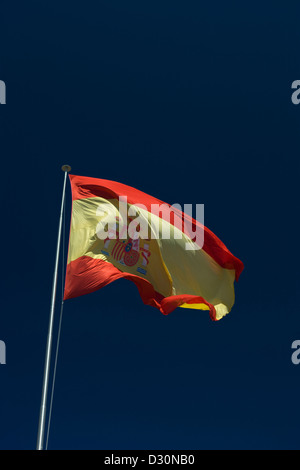 LARGE SPANISH FLAG FLYING ON FLAG POLE WITH BLUE SKY BACKGROUND Stock ...
