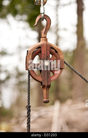Old rusty pulley with rope Stock Photo - Alamy
