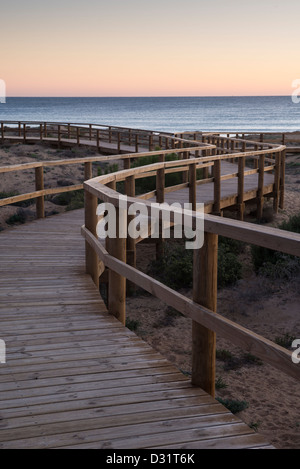 Arenales del Sol, Alicante, Spain- June 20, 2025: Man entering the sea ...