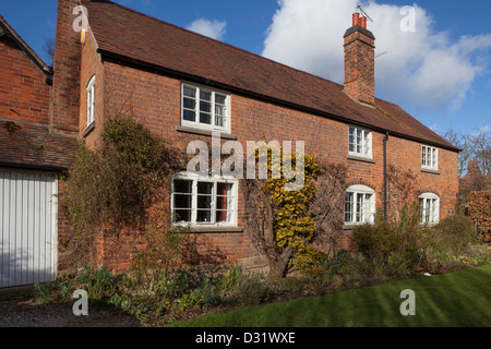 Brick cottage in the village of Bredon, Worcestershire, England, UK ...