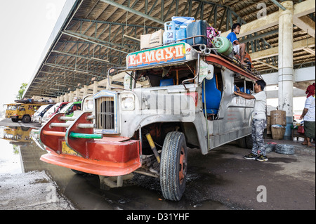 Overloaded jeepney waiting for passengers at Puerto Princesa bus ...