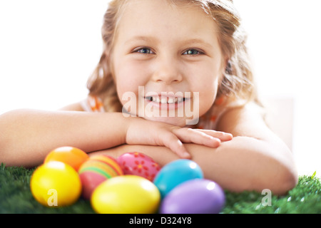 Photo of adorable cheerful girl toothy smile arm hold paper heart card ...