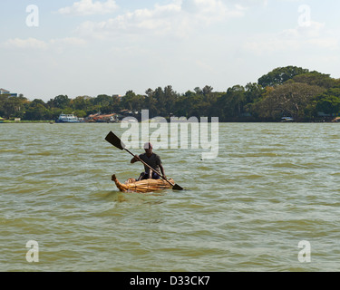 A priest on a traditional papyrus kayak paddles to one of the many ...