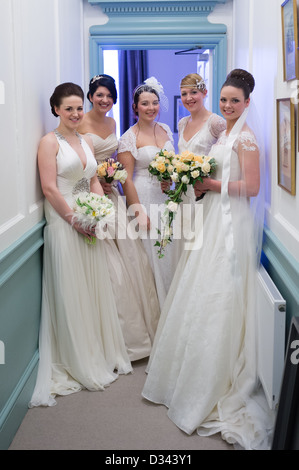 Models dressed as brides wearing wedding dresses at a Bridal Fayre ...