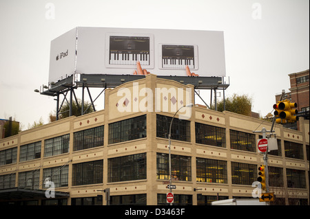 Advertising for the Apple iPad Mini on a billboard atop the Apple store ...