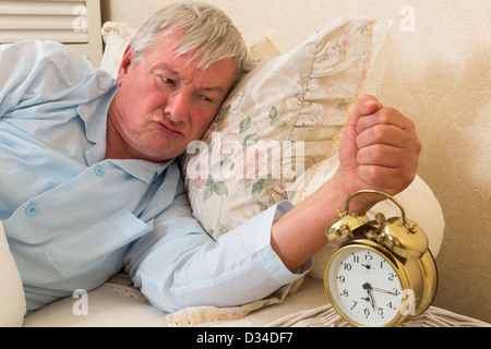 Grumpy old man waking up in the morning Stock Photo - Alamy