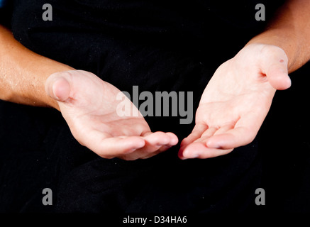 White man's hands open to receive double hand-fulls Stock Photo - Alamy