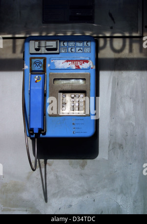 retro red pay phone operated by coins isolated on white background with ...