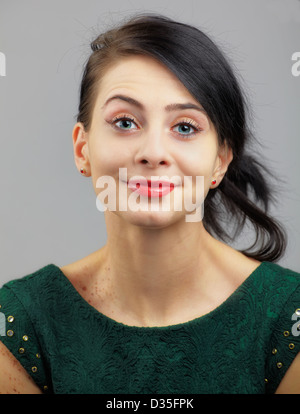 Young adult woman over grey grunge wall wearing fashion business outfit ...