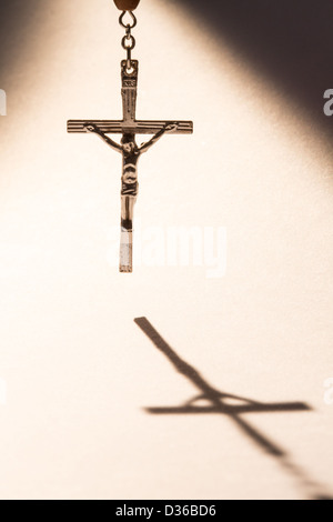 Crucifix casting a shadow Stock Photo - Alamy