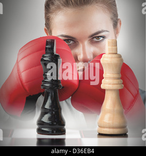 Female boxer behind the chess board Stock Photo - Alamy