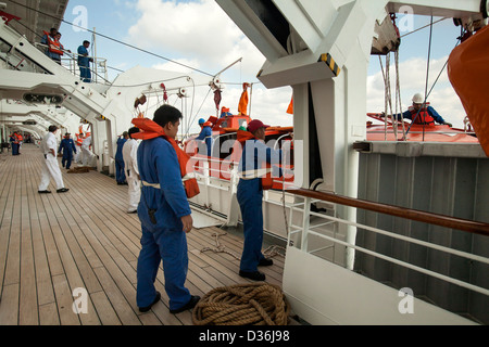 Ship's crew during a safety drill Stock Photo - Alamy