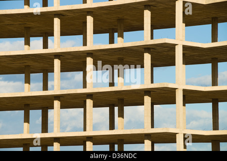 Prefabricated concrete skeleton frame building being constructed, building site. Shot with a ...