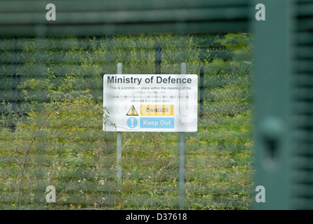 Ministry of Defence fence and keep out warning sign on steep South West ...
