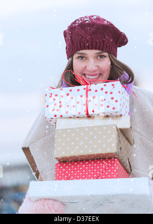 Portrait of young smiling woman with present Stock Photo - Alamy