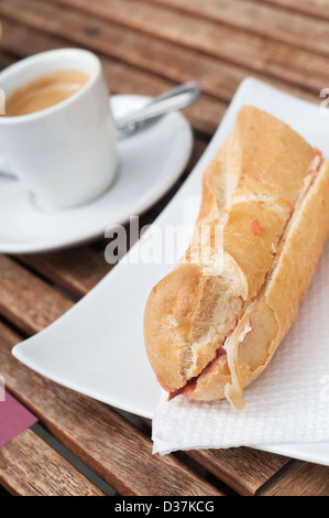 Coffee and a baguette with Serrano ham Stock Photo - Alamy