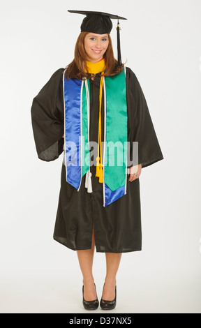 Portrait of happy graduate student holding empty banner. Isolated on ...