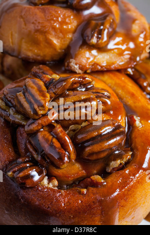 High angle shot of fresh cinnamon roll buns and dried oranges Stock ...