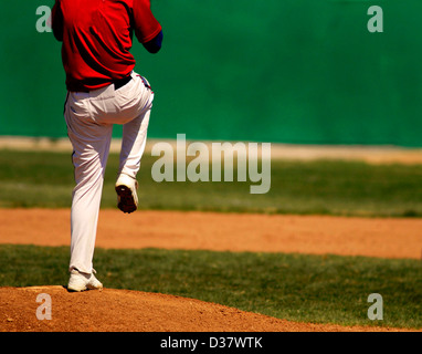 Pitcher Baseball Player with a red uniform on baseball Stadium Stock ...