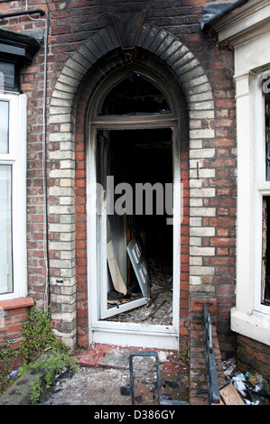 Severe house fire front door UPVC Burnt Melted Stock Photo - Alamy