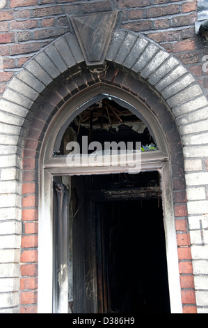 Severe house fire front door UPVC Burnt Melted Stock Photo - Alamy