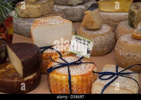 Variety of cheeses on display in cheese room of farm shop, Suffolk ...