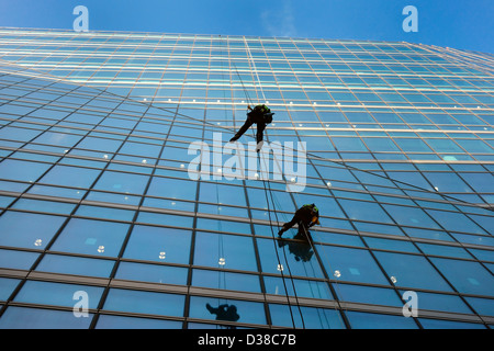 Two men abseiling a building Stock Photo - Alamy