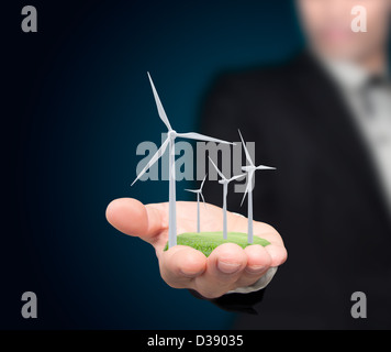 Wind turbines on the hands businessman Stock Photo - Alamy