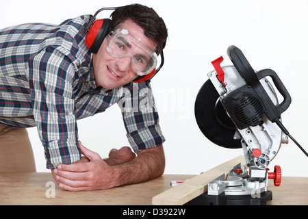 happy man using a sawing a circular saw Stock Photo - Alamy