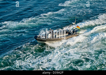 A SWAT -special forces police- inflatable rigid hull (zodiac type) boat ...