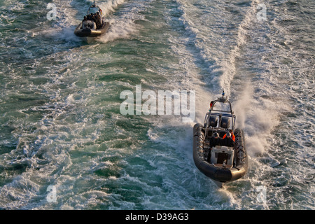 A SWAT -special forces police- inflatable rigid hull (zodiac type) boat ...