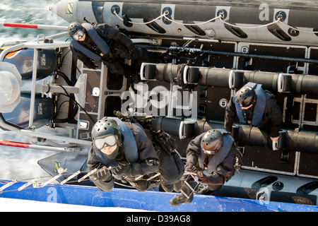 A SWAT -special forces police- inflatable rigid hull (zodiac type) boat ...