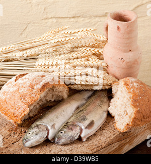Fish, bread and wine as symbols of Jesus life Stock Photo - Alamy