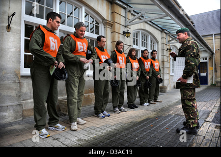 A recruiting officer with a chart of tests for potential recruits at ...
