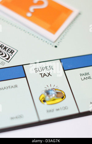 Super Tax on a Monopoly Game Board Stock Photo - Alamy