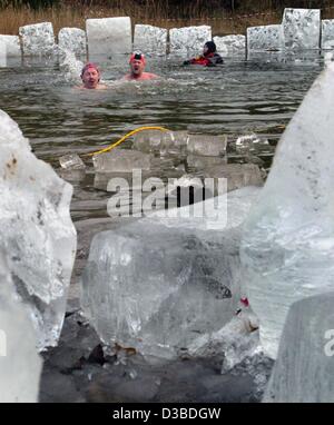 Ice cold water swimmers in lake Stock Photo - Alamy
