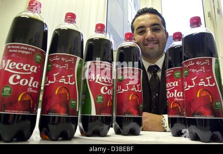 (dpa) - Mahmoud Hinnaui presents some bottles of 'Mecca Cola' in ...