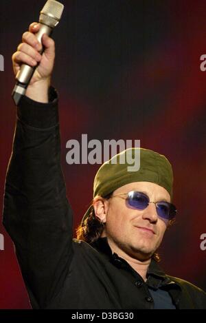 (dpa) - Bono, singer of the Irish rock band U2, smiles after his ...