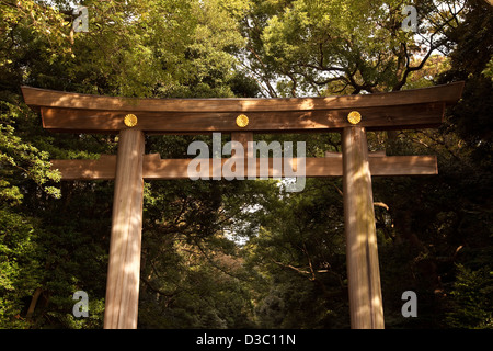 A huge wooden torii gate is at the entrance to the Meiji Jingu Shrine ...