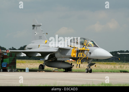 A Hungarian Air Force Saab JAS 39 Gripen performing an aerial maneuver ...