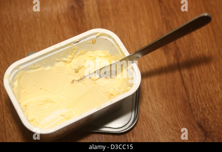 butter tub with knife Stock Photo - Alamy